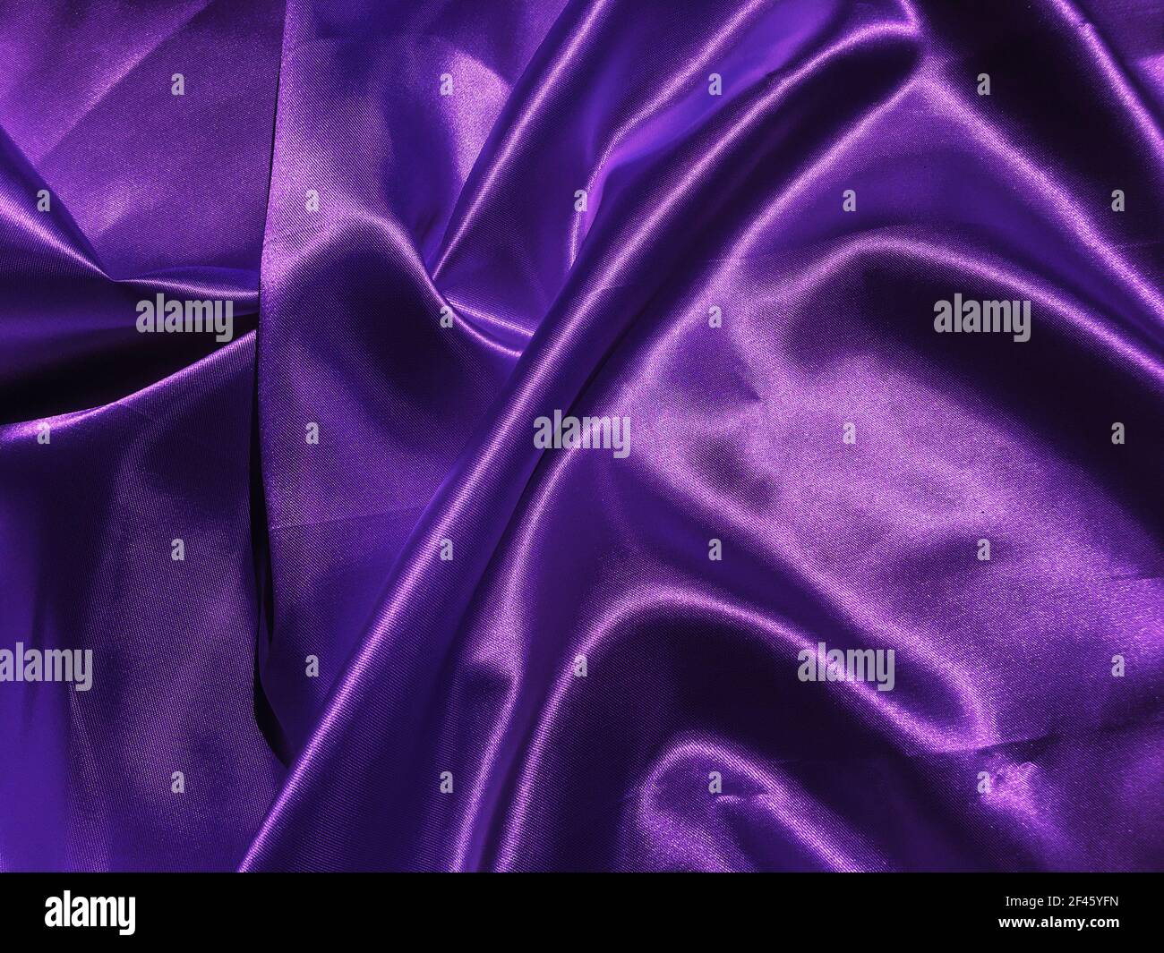 Smooth purple fabric or satin texture background with copy space for ...