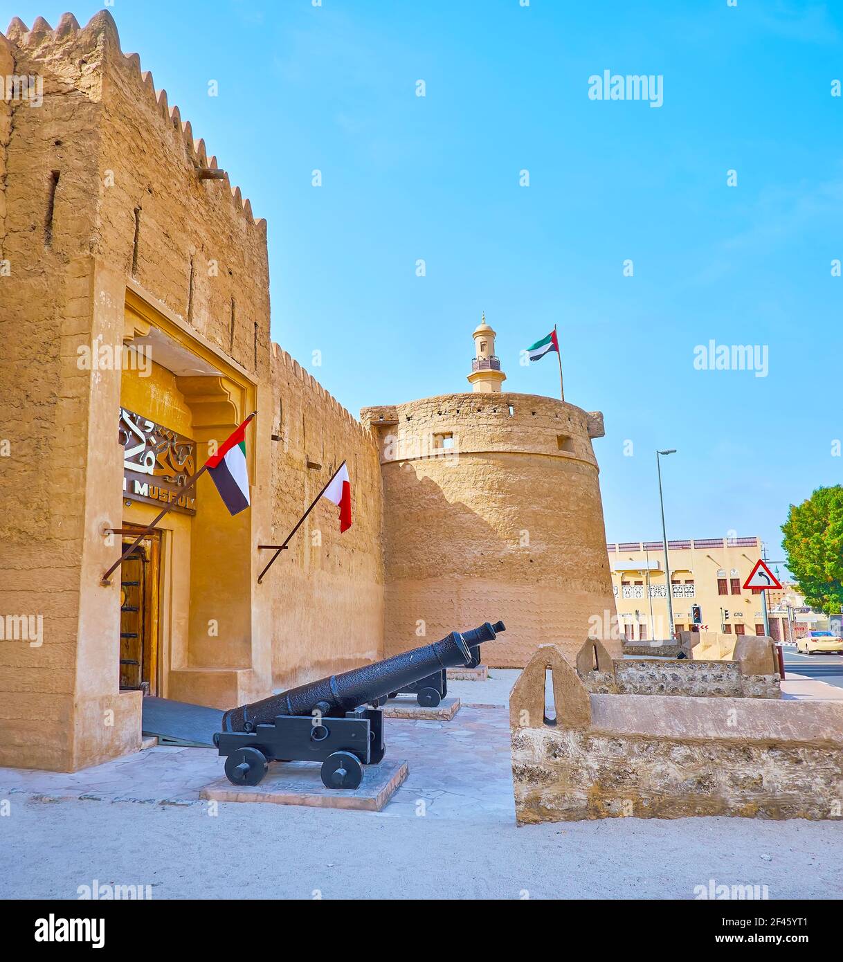 The vintage cannons in front of medieval adobe Al Fahidi Fort ...