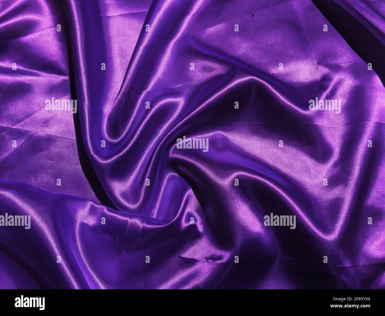 Beautiful smooth purple fabric texture background with copy space for ...