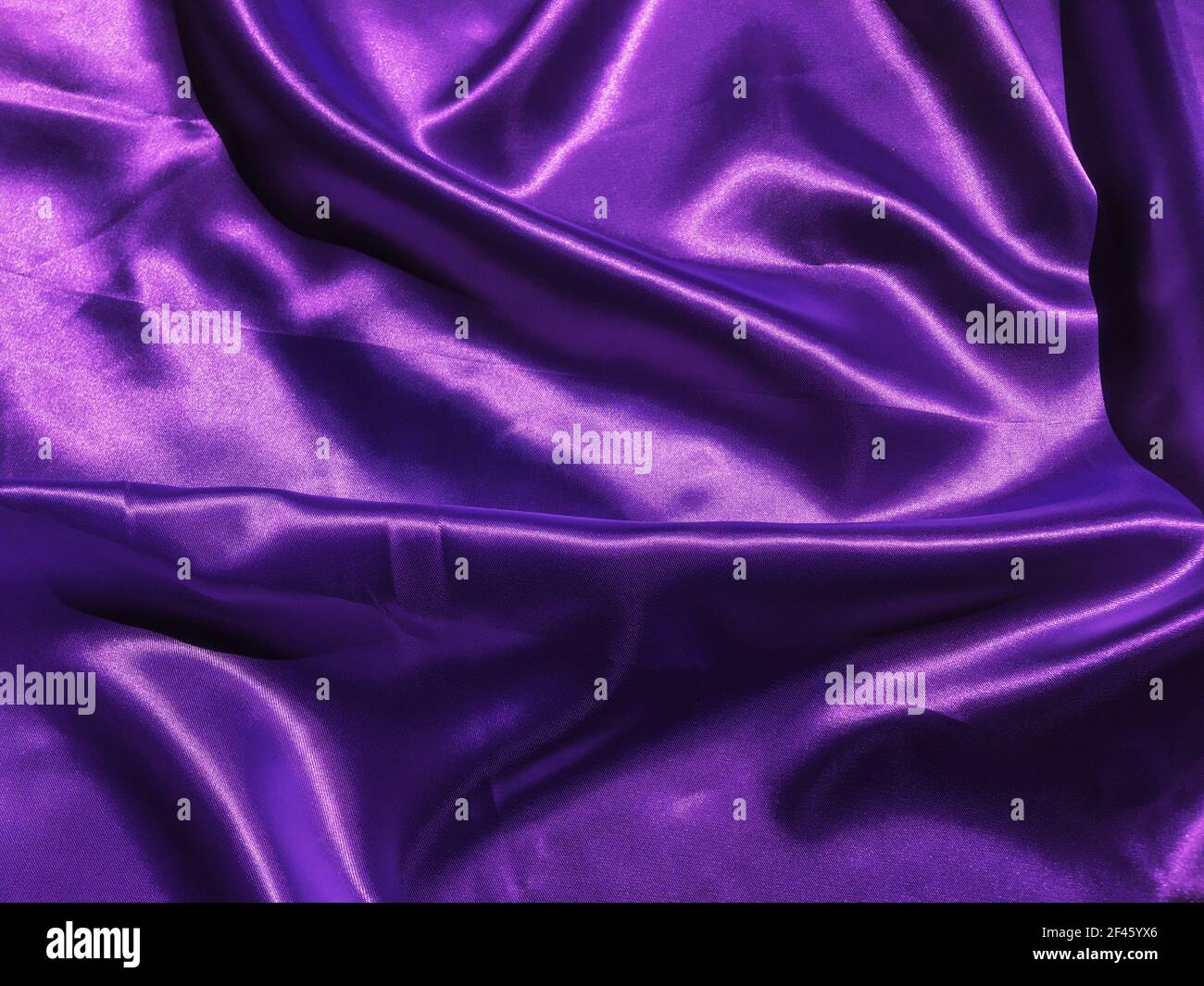 Beautiful smooth purple fabric texture background with copy space for ...