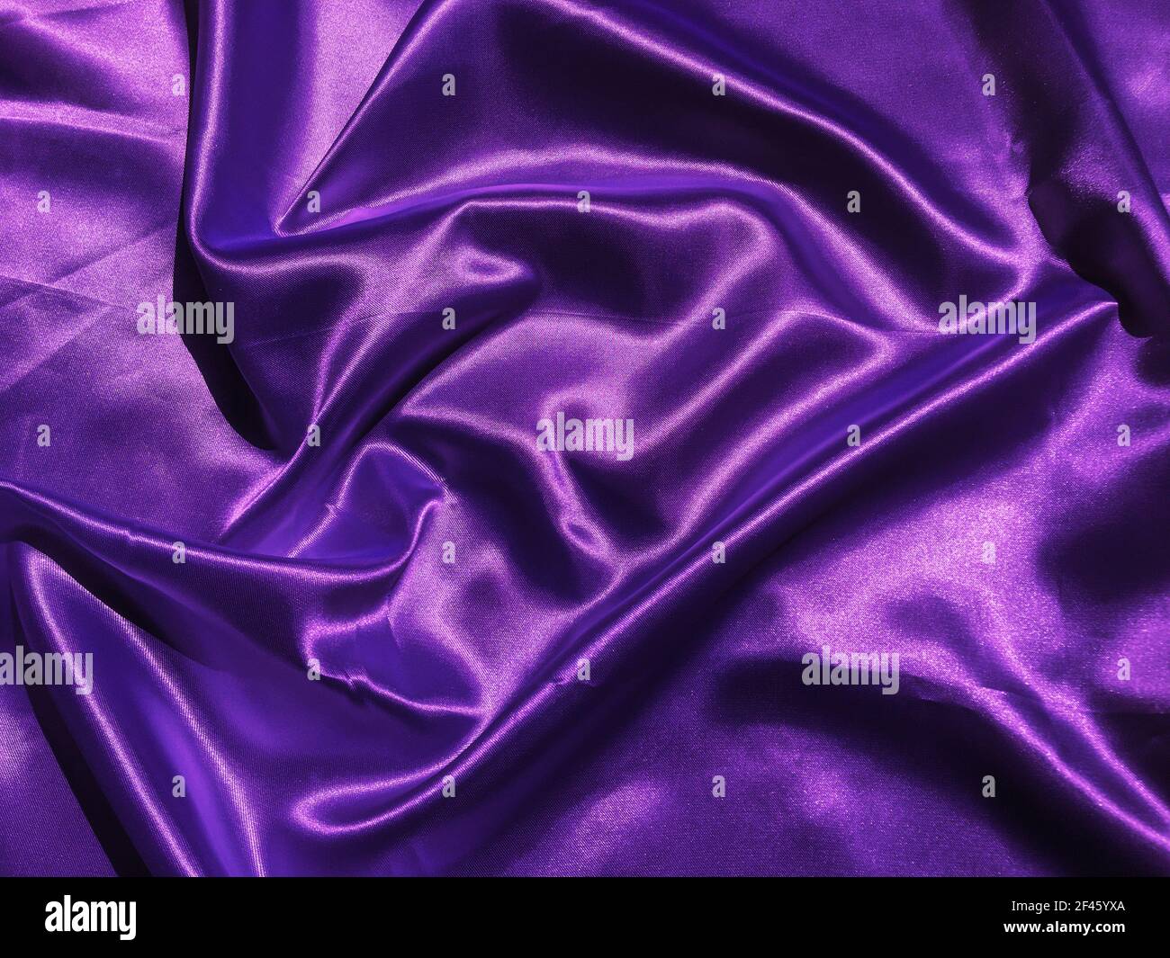 Beautiful smooth purple fabric texture background with copy space for ...