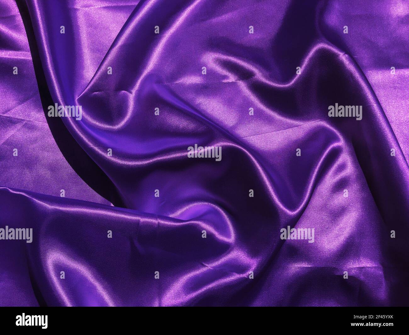 Beautiful smooth purple fabric texture background with copy space for ...