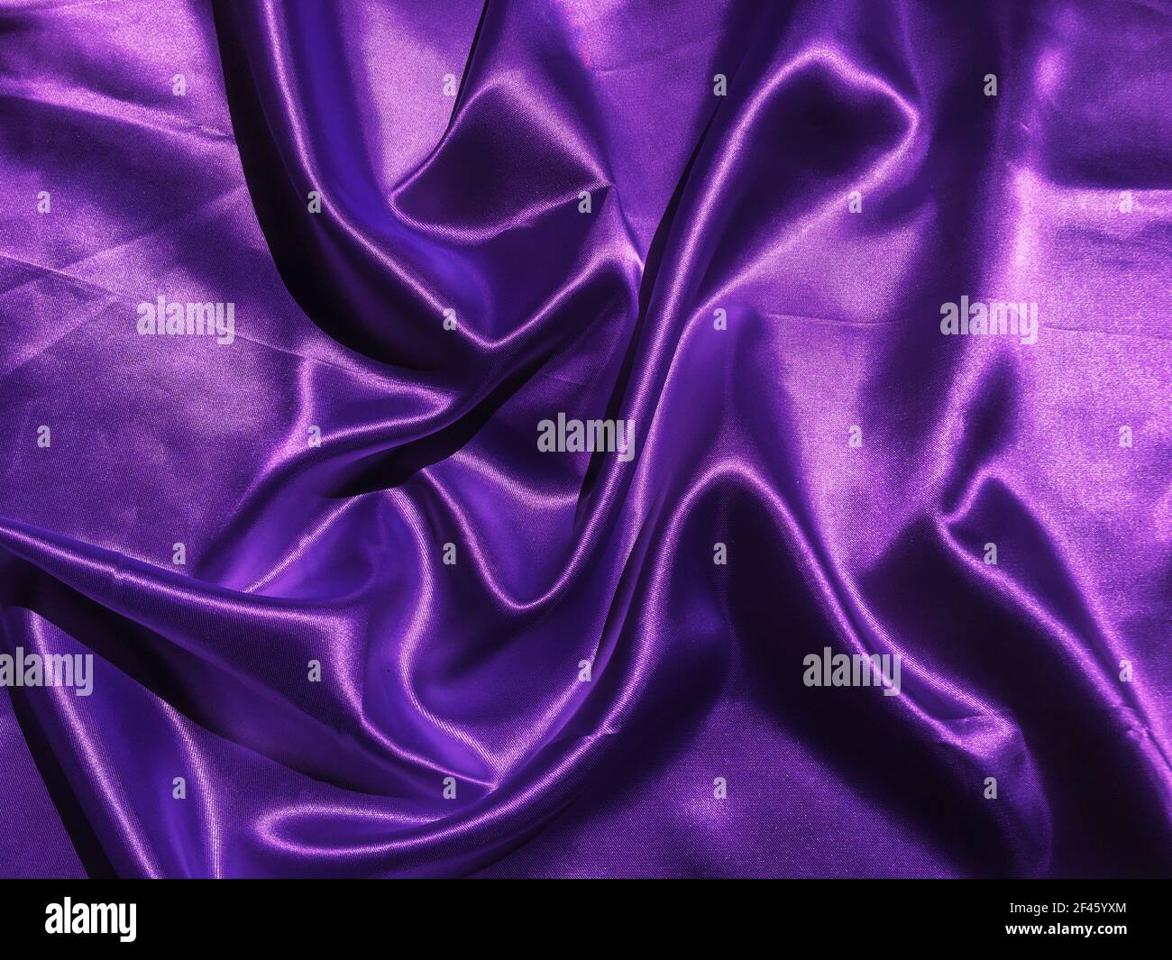 Beautiful smooth purple fabric texture background with copy space for ...