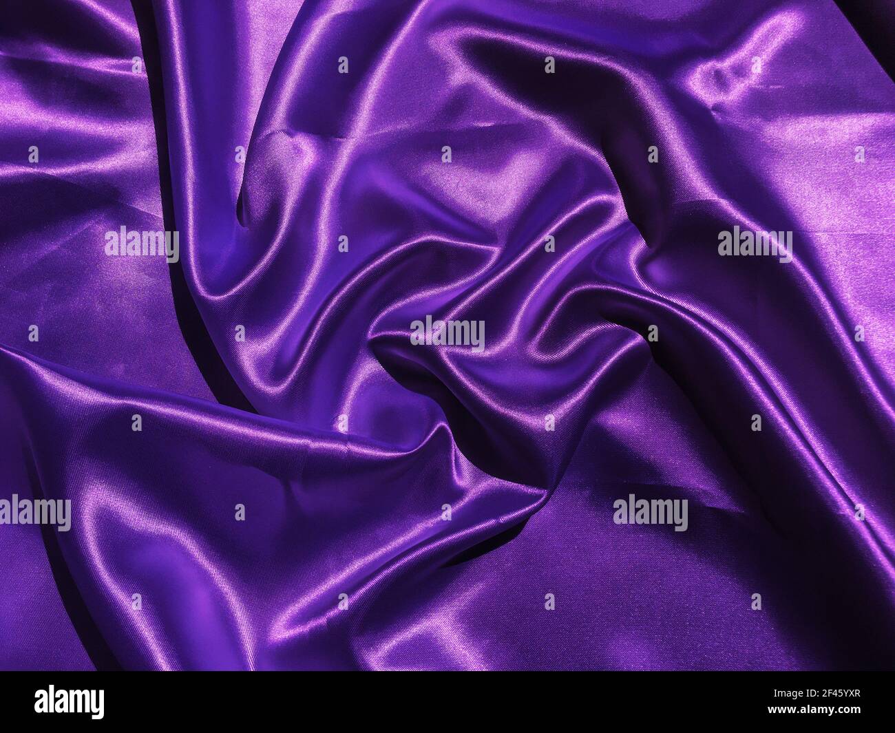 Beautiful smooth purple fabric texture background with copy space for ...