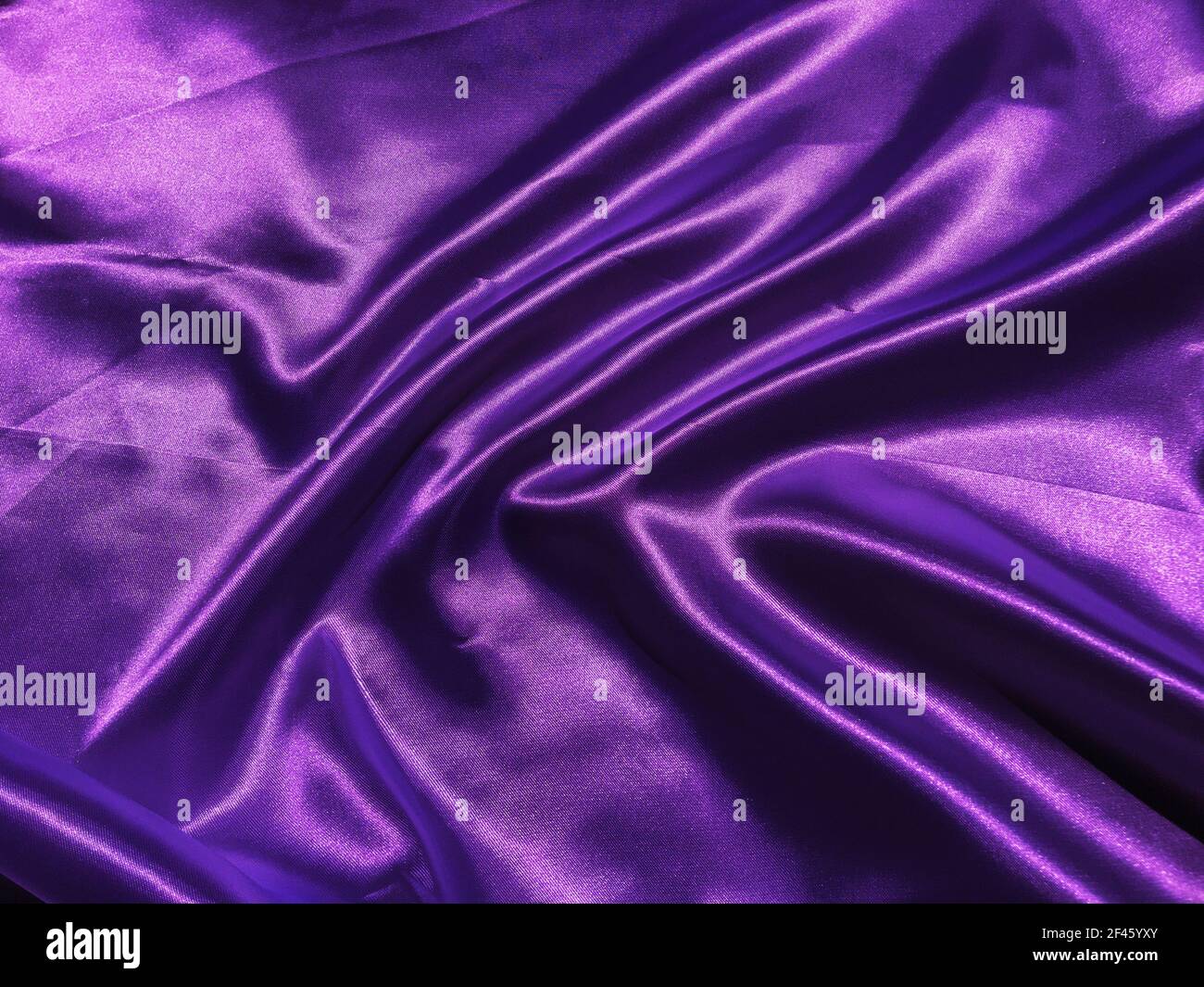 Beautiful smooth purple fabric texture background with copy space for ...
