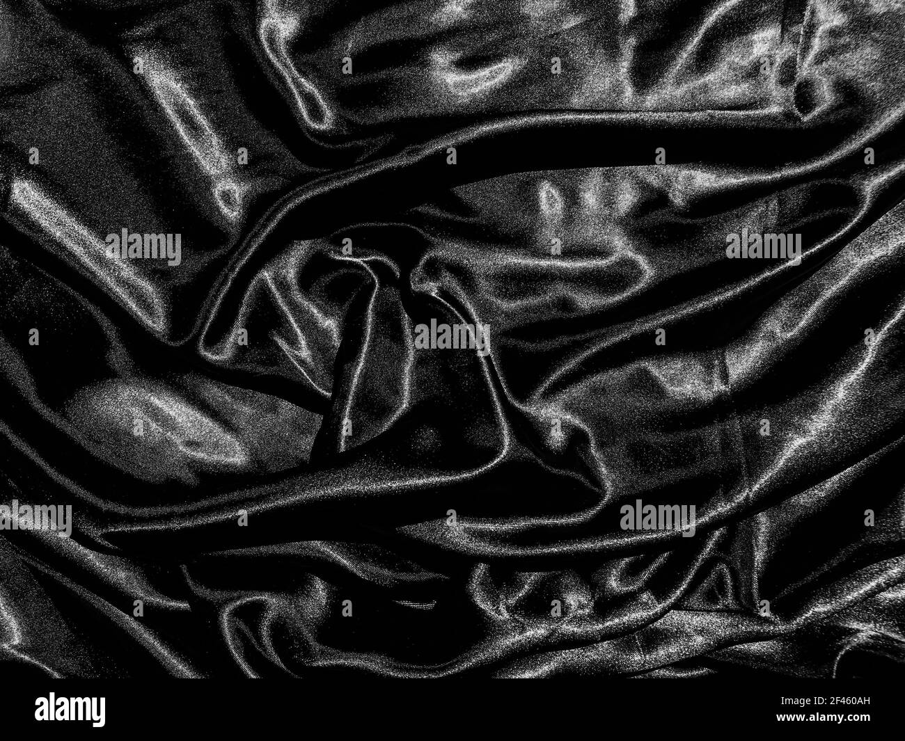 Black cloth or fabric texture background with liquid wave or wavy folds ...