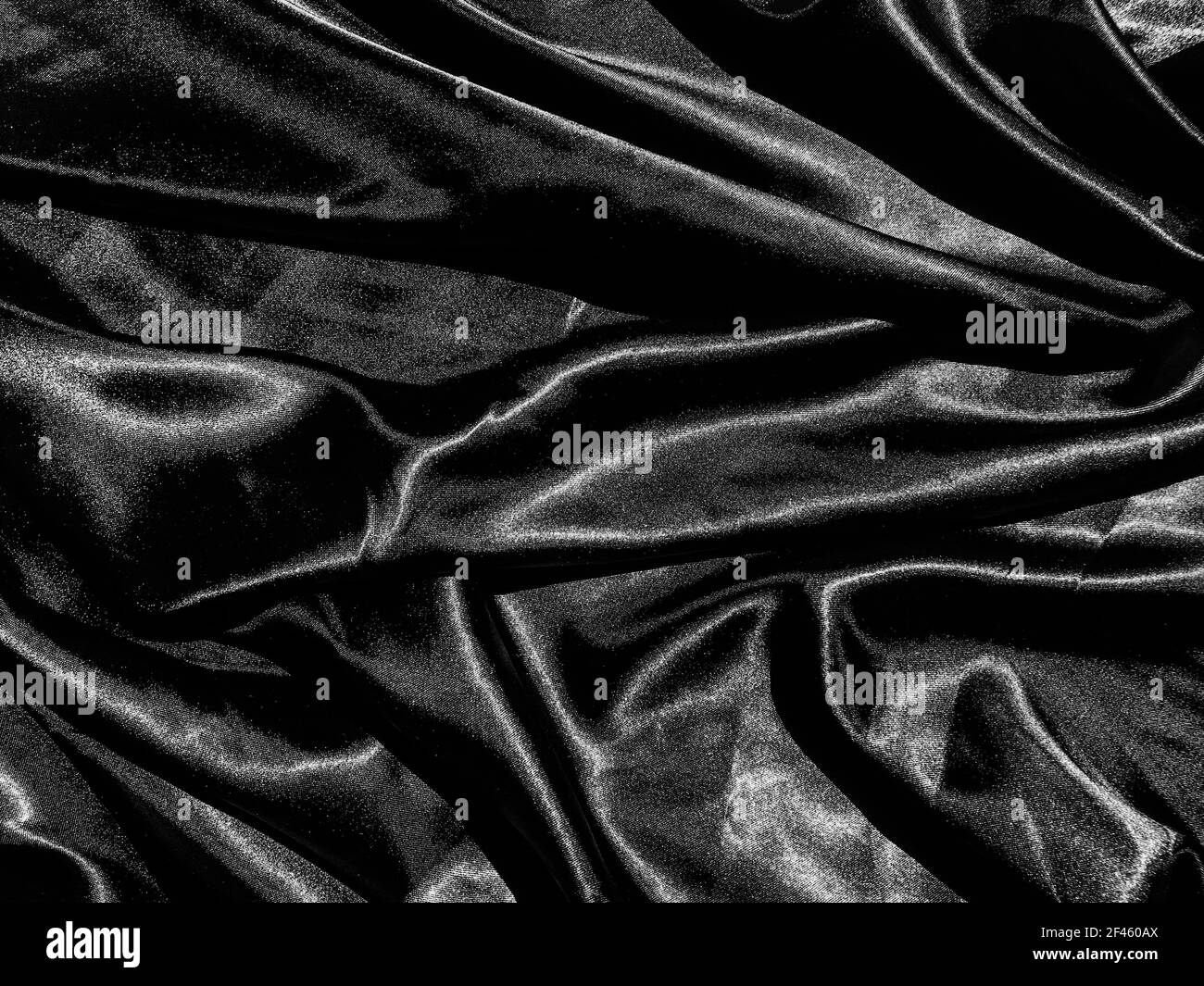 Dark silk or satin texture background with copy space for text or ...