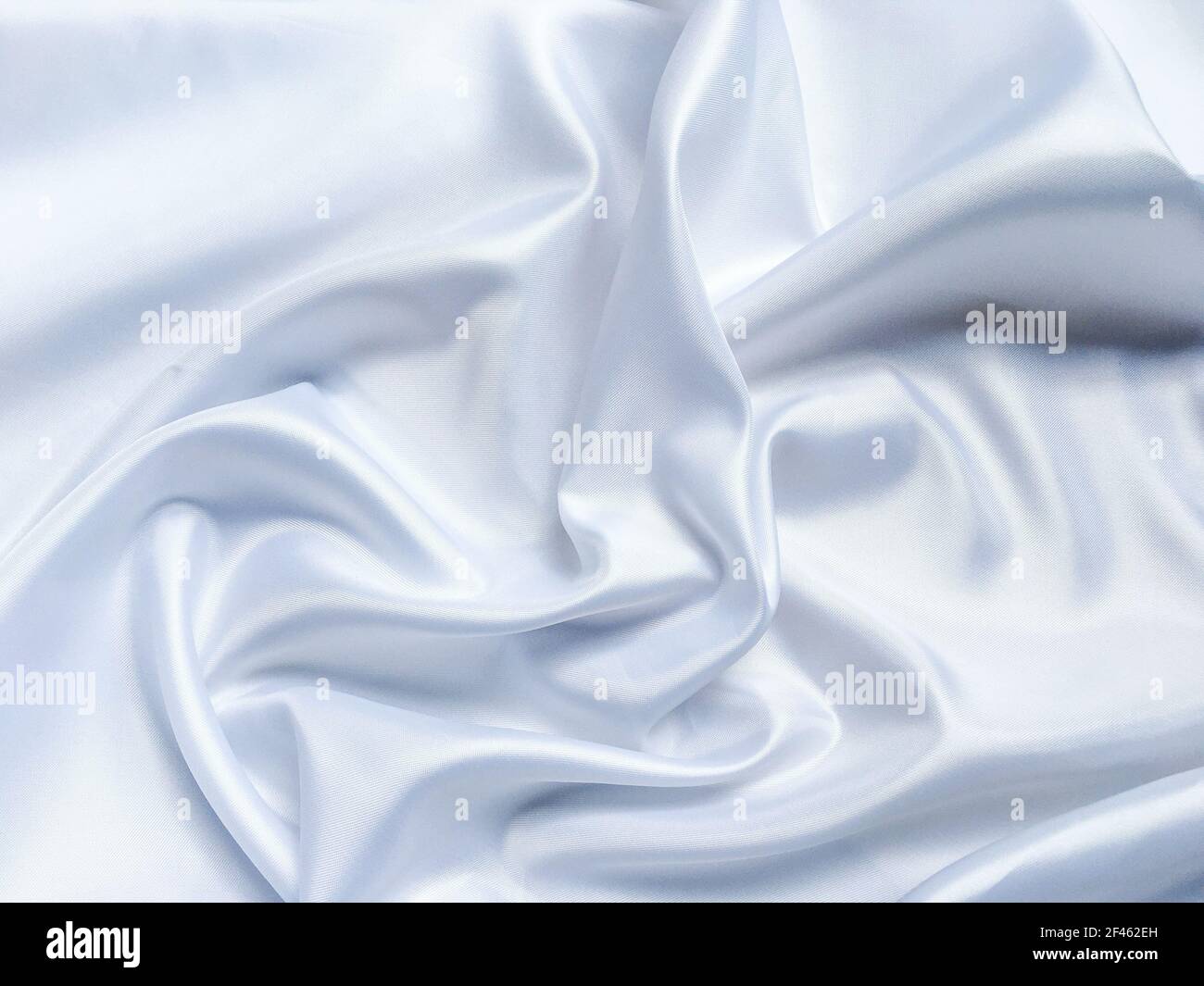 white crumpled fabric texture background. Silk curtain with fold waves ...