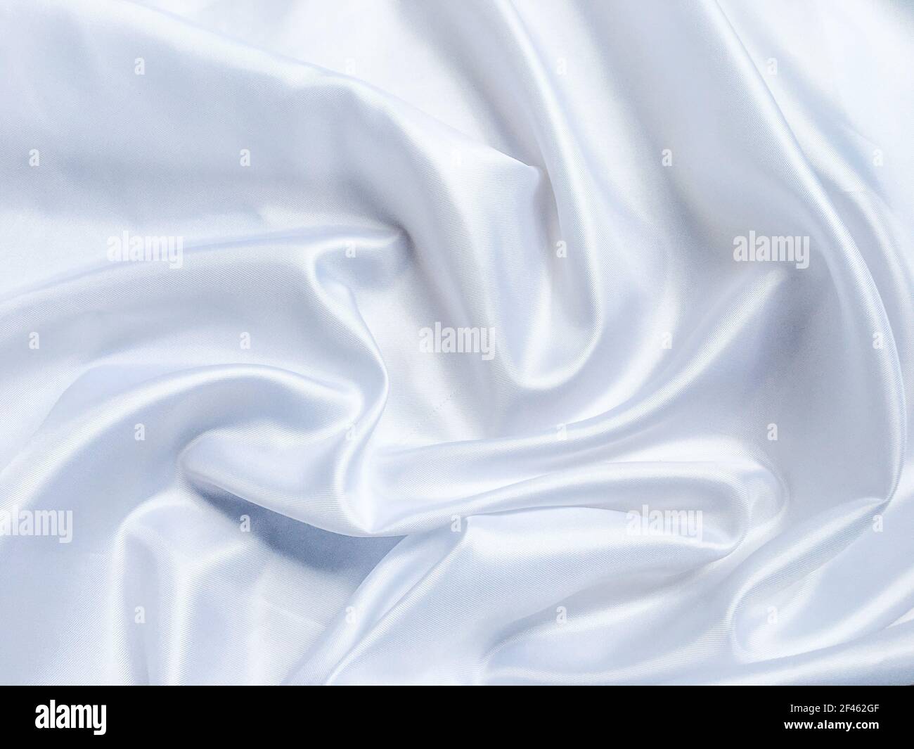 white crumpled fabric texture background. Silk curtain with fold waves ...