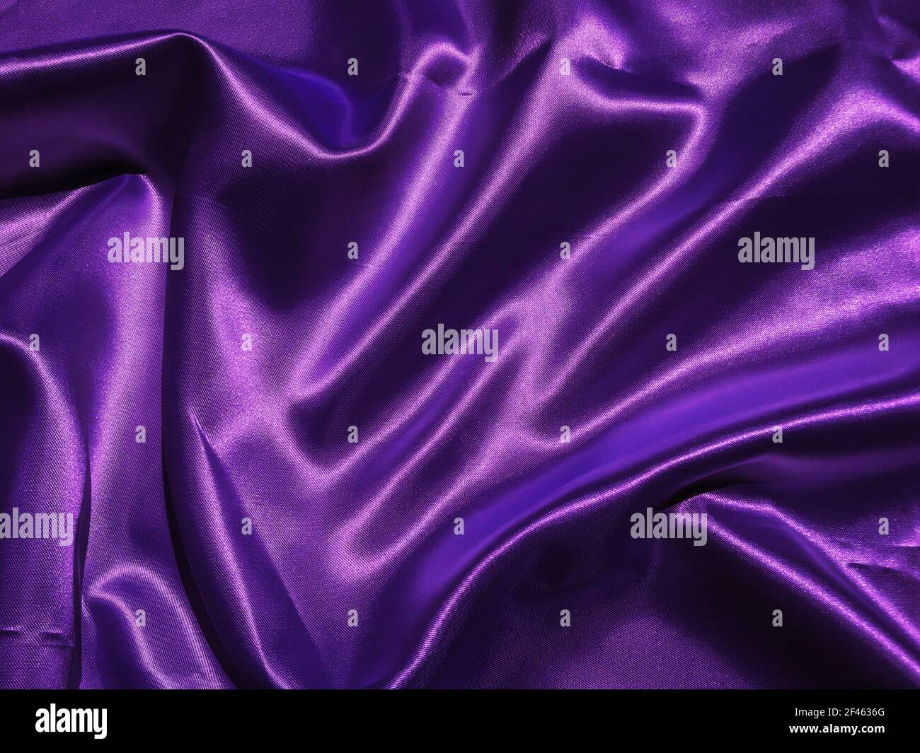 Smooth purple fabric or satin texture background with copy space for ...