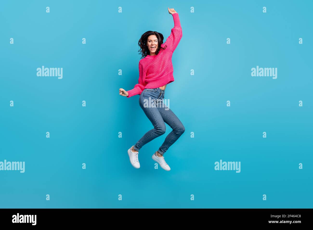 Full length portrait of astonished girl jump fists up open mouth shout ...