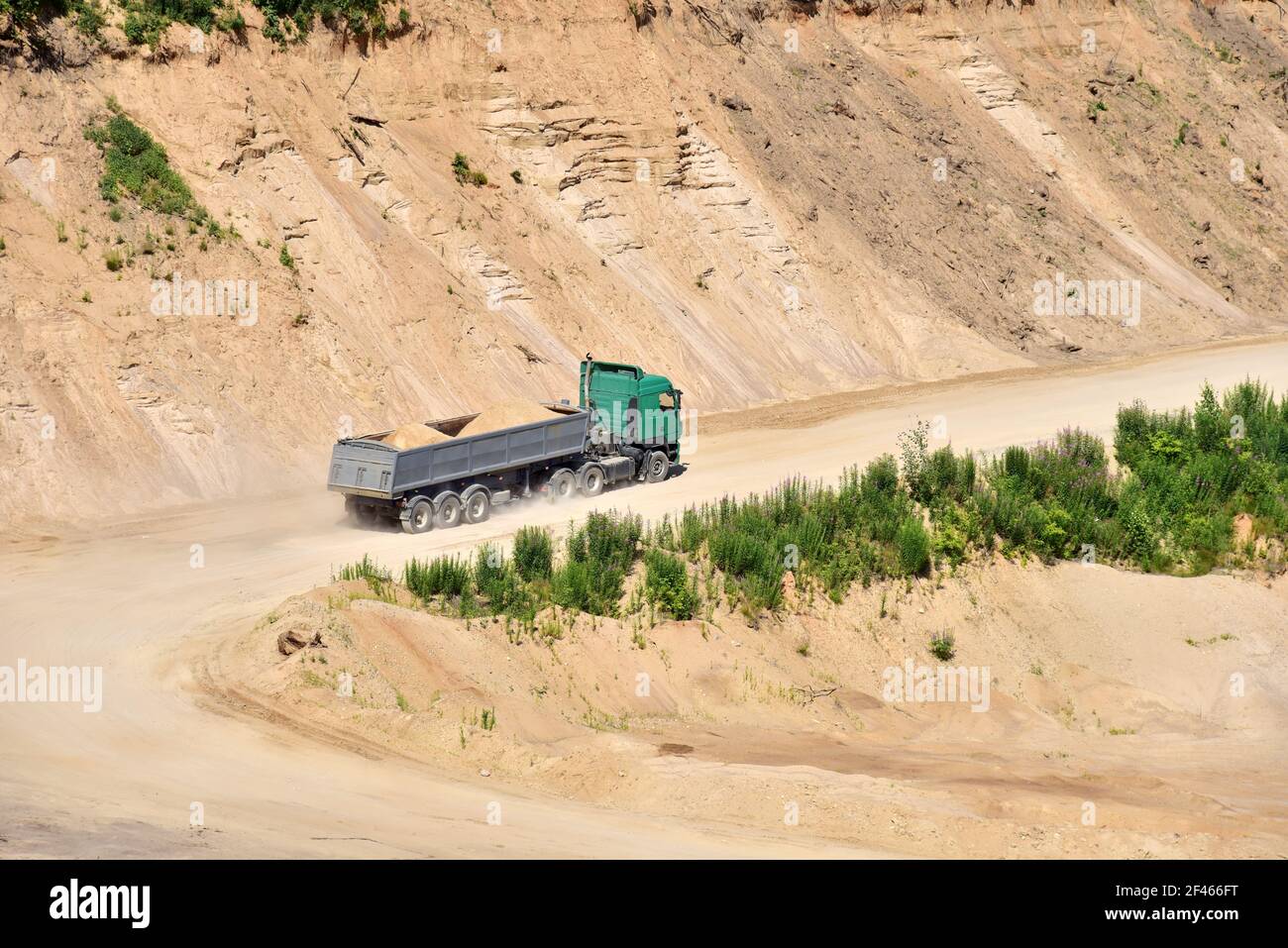 Truck with tipper semi trailer transported sand from the open pit. Dump ...