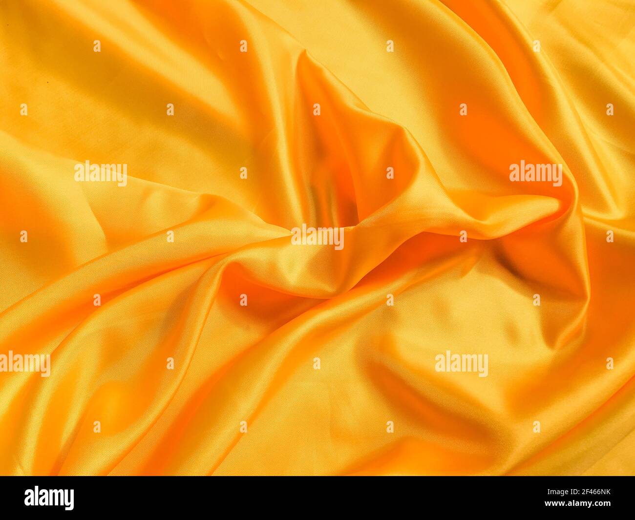 Yellow silk or satin texture background with copy space for design ...