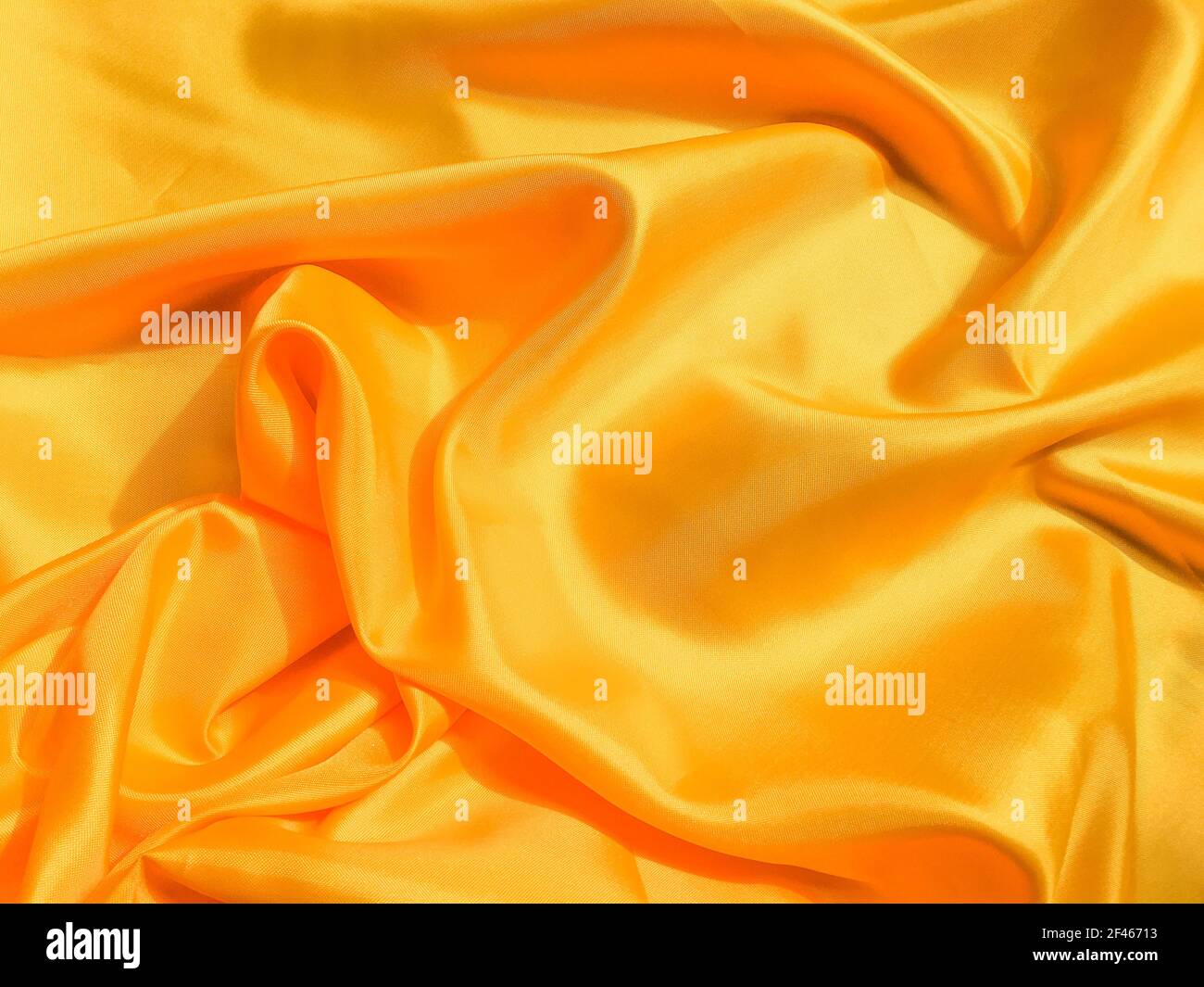 Yellow silk or satin texture background with copy space for design ...