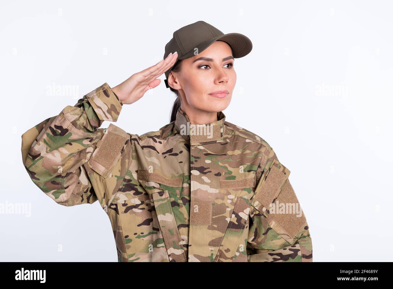 Photo of young woman confident soldier army officer show hand salute ...