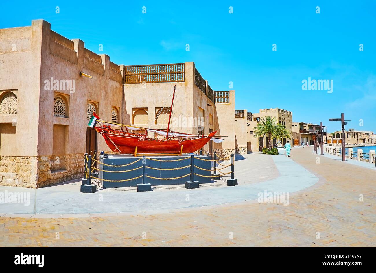The stand with traditional wooden fishing sambuk boat on embankment of ...