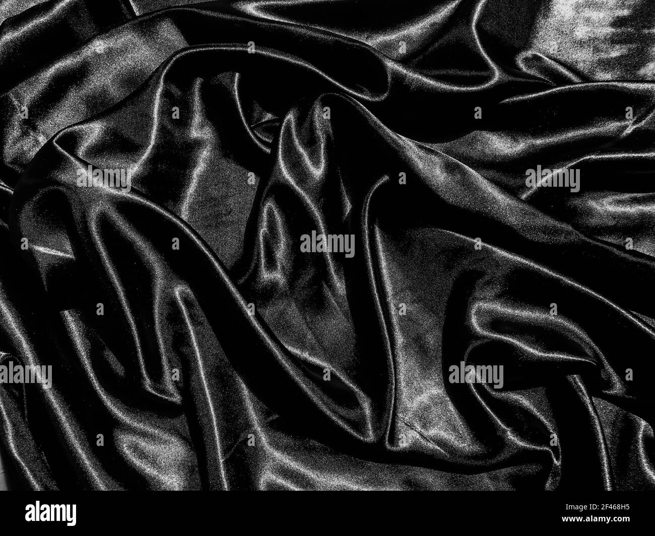Black satin texture background with liquid wave or wavy folds ...