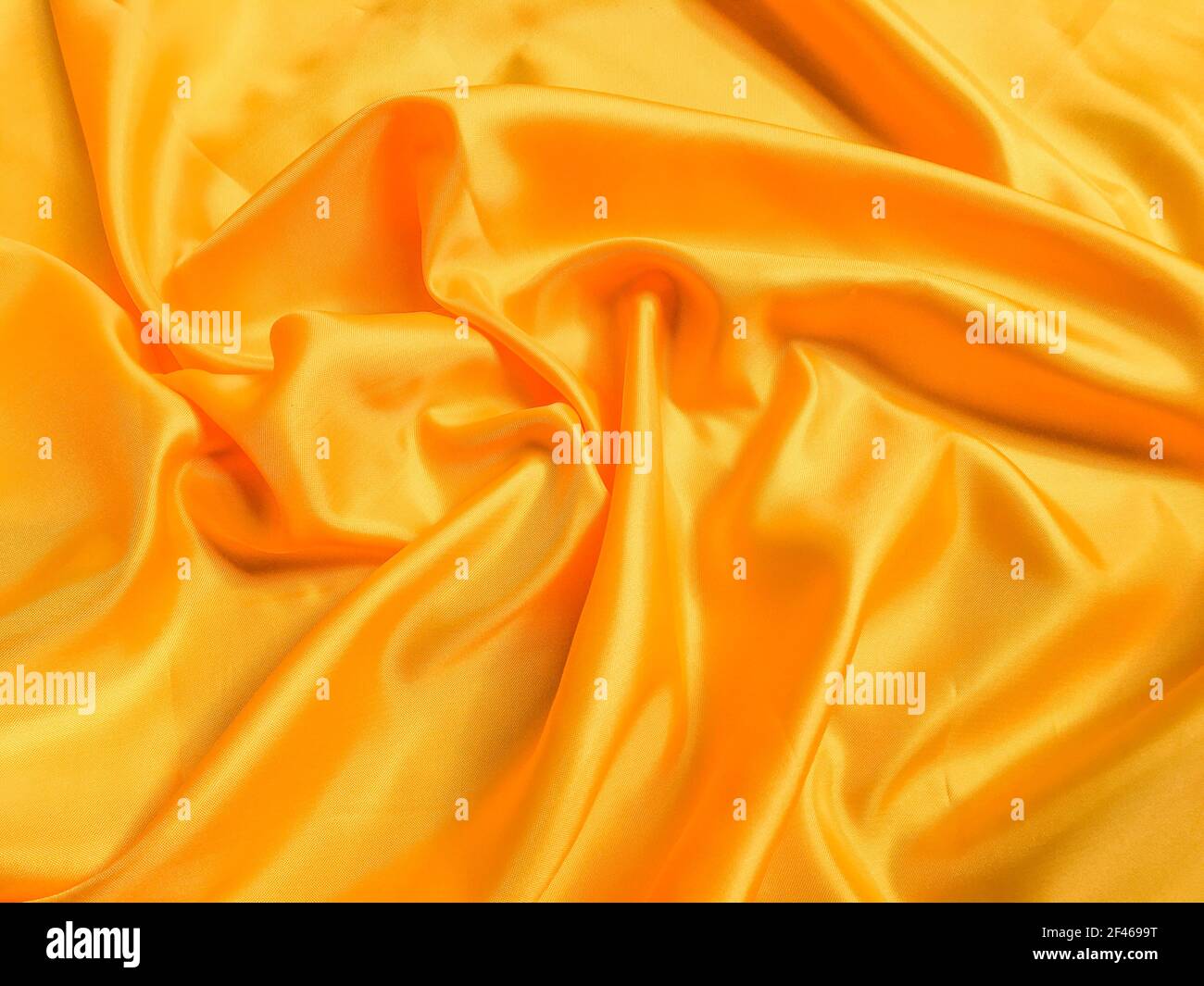 Yellow silk or satin texture background with copy space for design ...