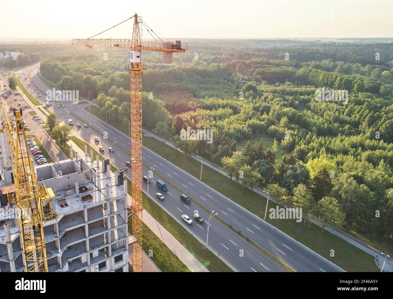 Building cranes on city road background aerial view Stock Photo - Alamy