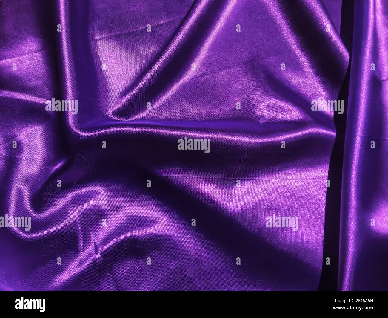 Beautiful smooth purple fabric texture background with copy space for ...