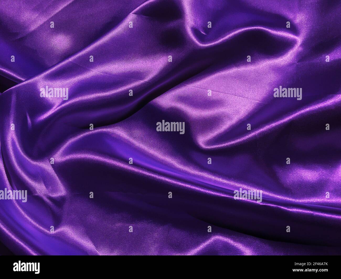 Beautiful smooth purple fabric texture background with copy space for ...