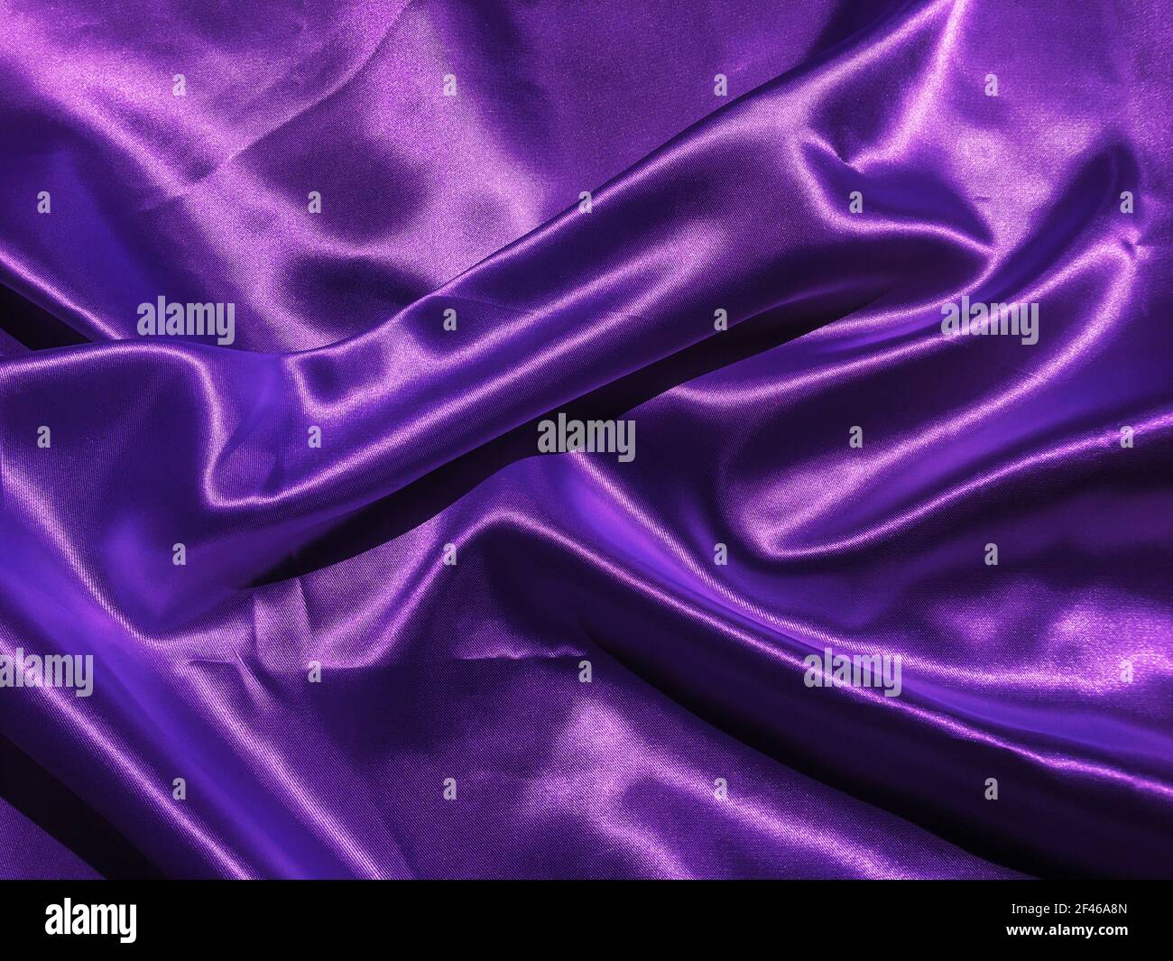 Beautiful smooth purple fabric texture background with copy space for ...