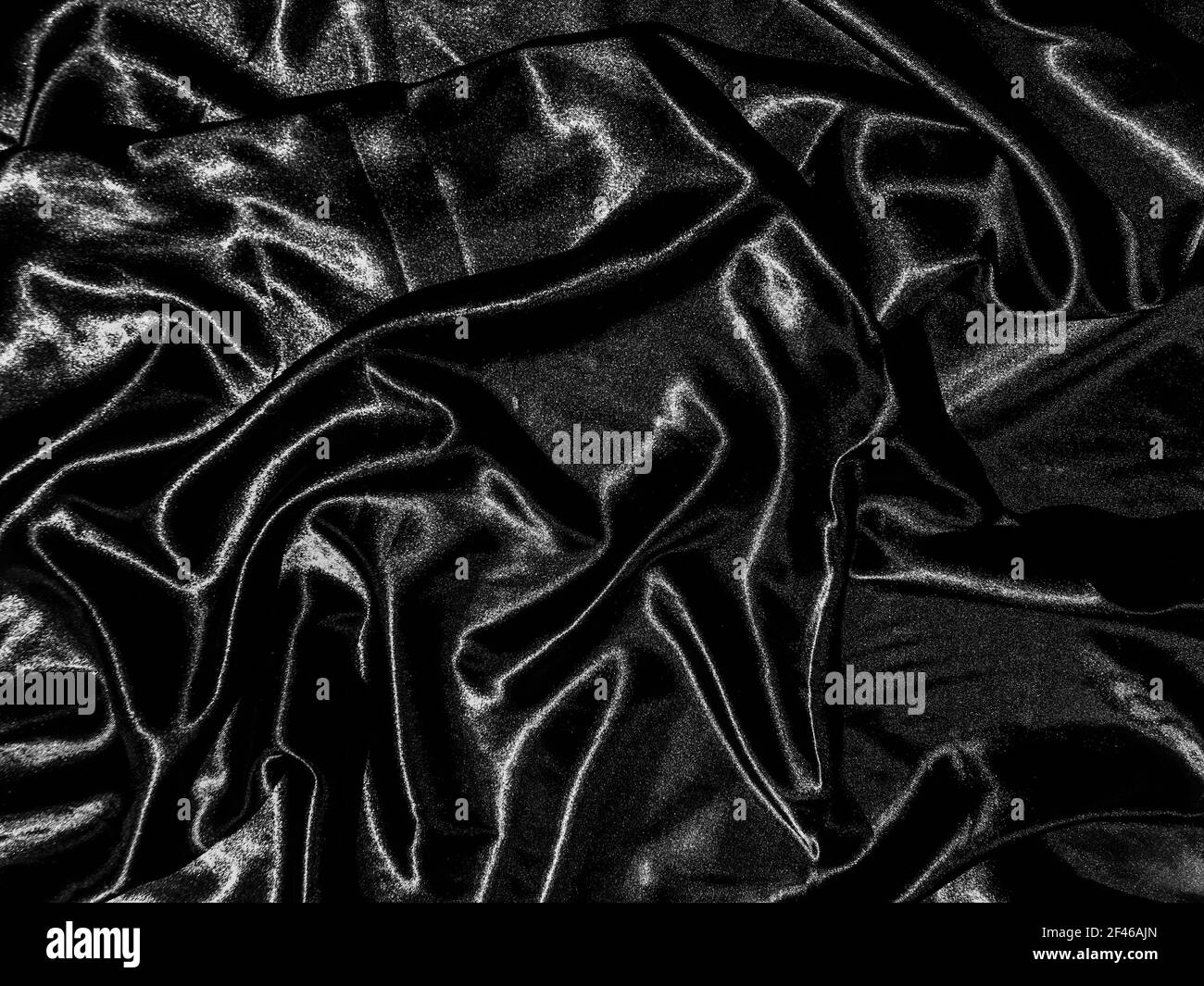 Black cloth or fabric texture background with liquid wave or wavy folds ...