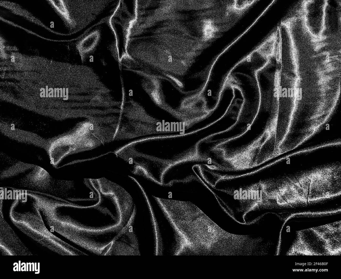Black cloth or fabric texture background with liquid wave or wavy folds ...