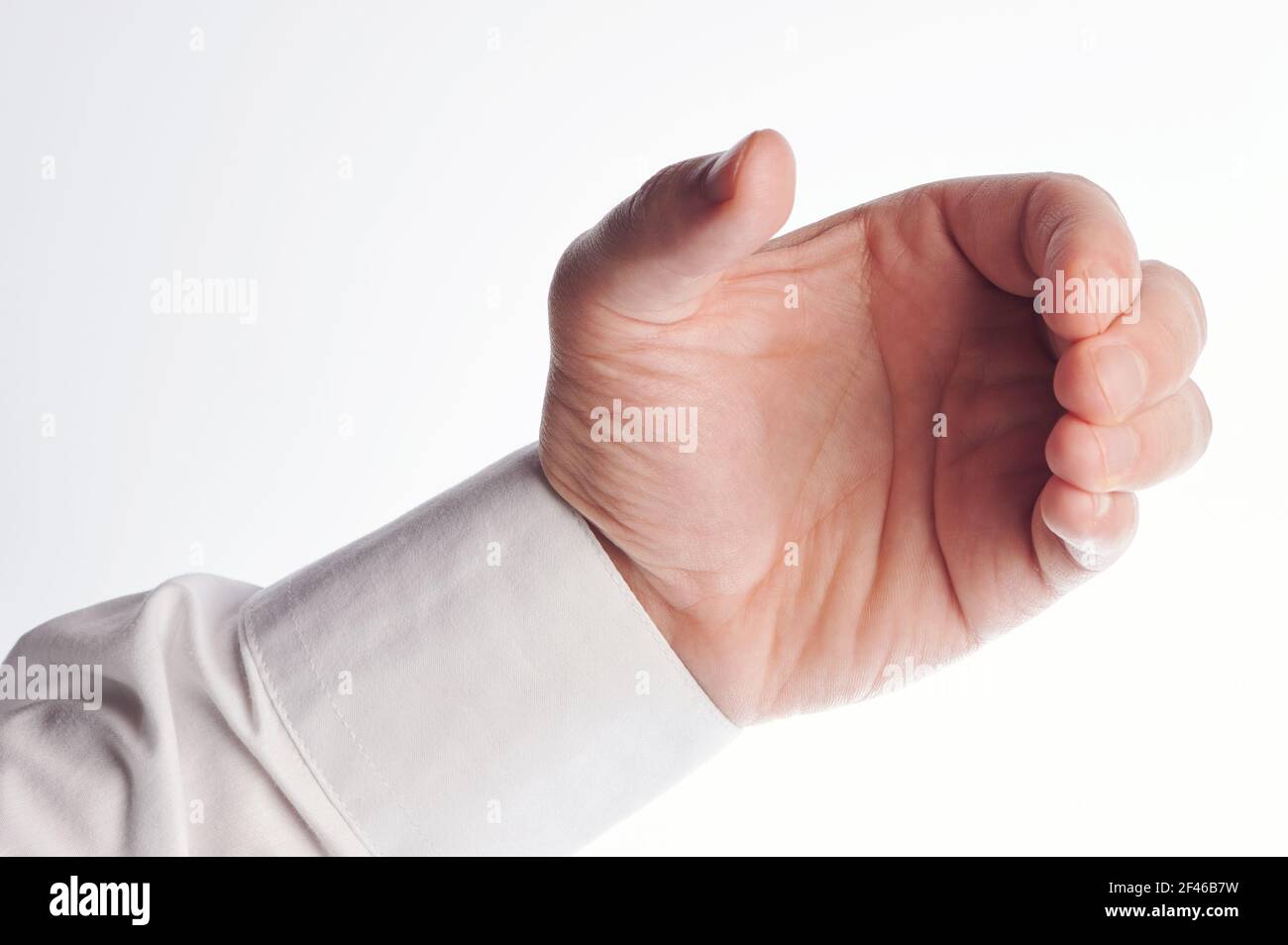 Human palm in grab pose close up view isolated on studio background ...