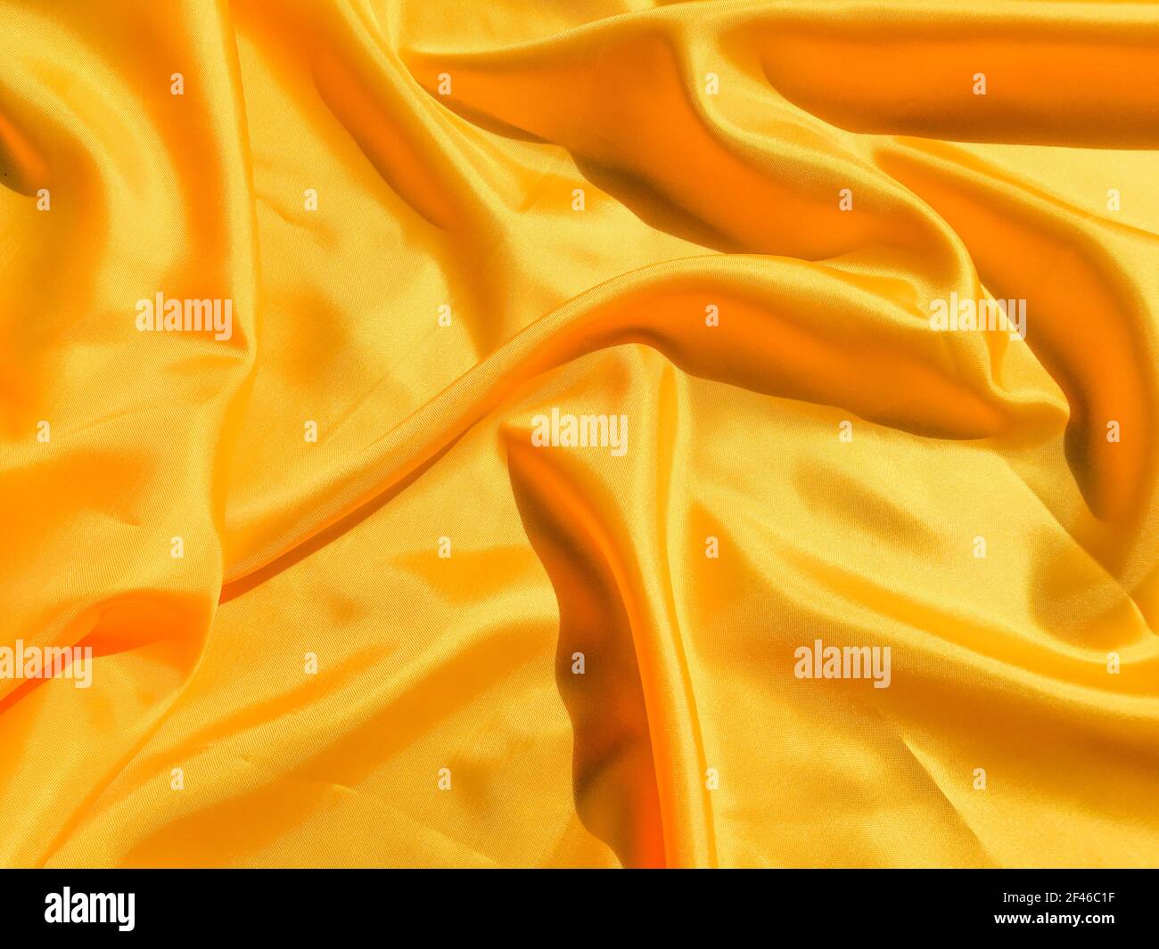 Bright yellow silk with waves moving for background. Abstract design ...