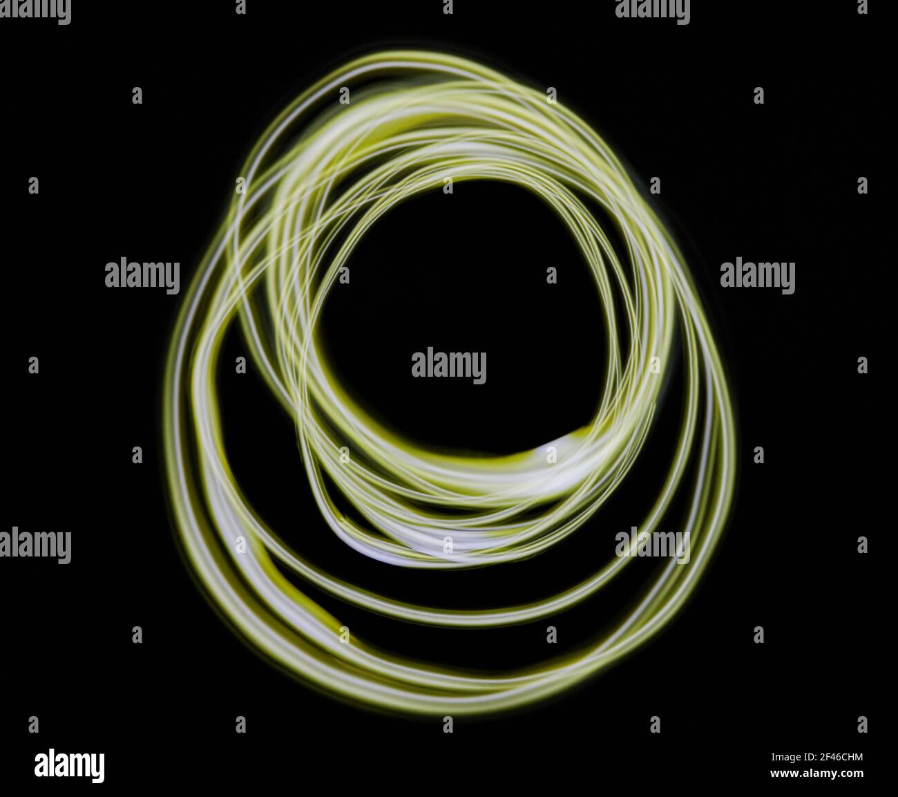 Yellow neon light flare isolated on black background Stock Photo - Alamy