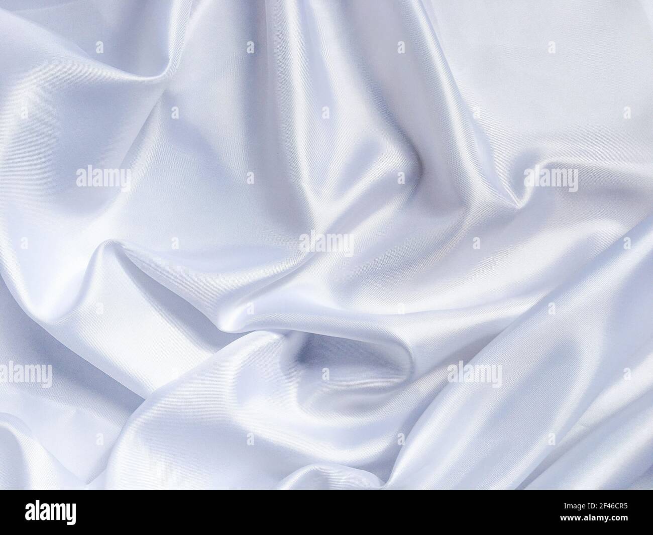 white crumpled fabric texture background. Silk curtain with fold waves ...