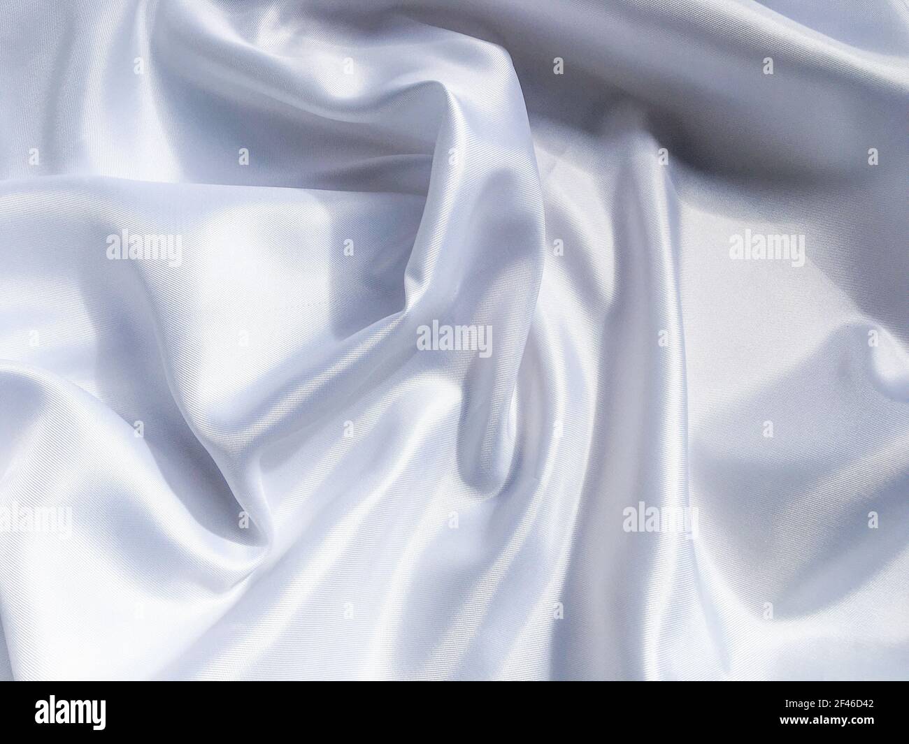 white crumpled fabric texture background. Silk curtain with fold waves ...