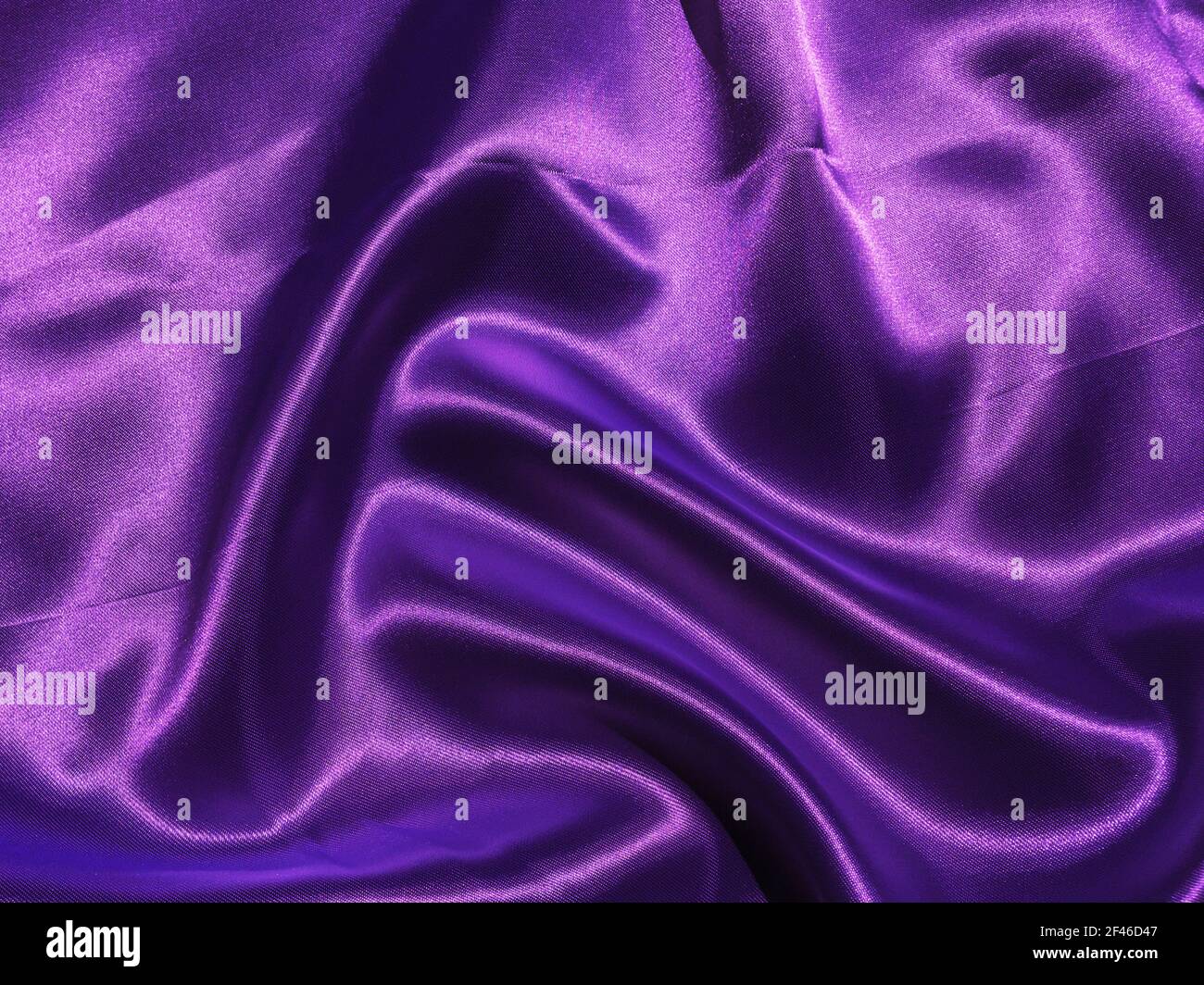 Smooth purple fabric or satin texture background with copy space for ...