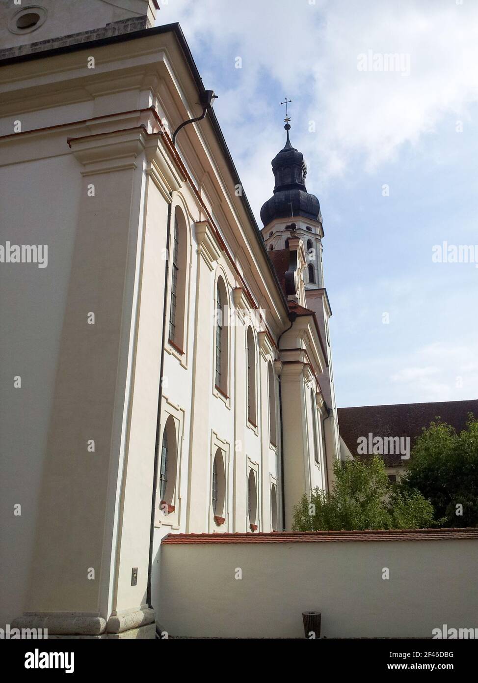 Side view of the large monastery Obermarchtal. The bulb tower rises ...