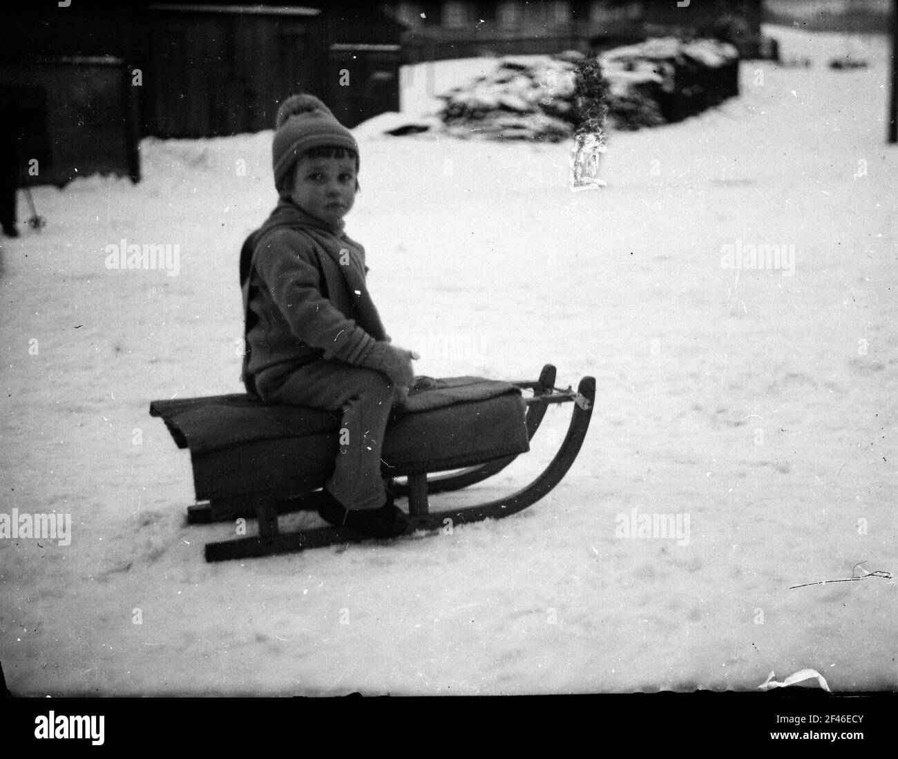 Child with sled Stock Photo - Alamy