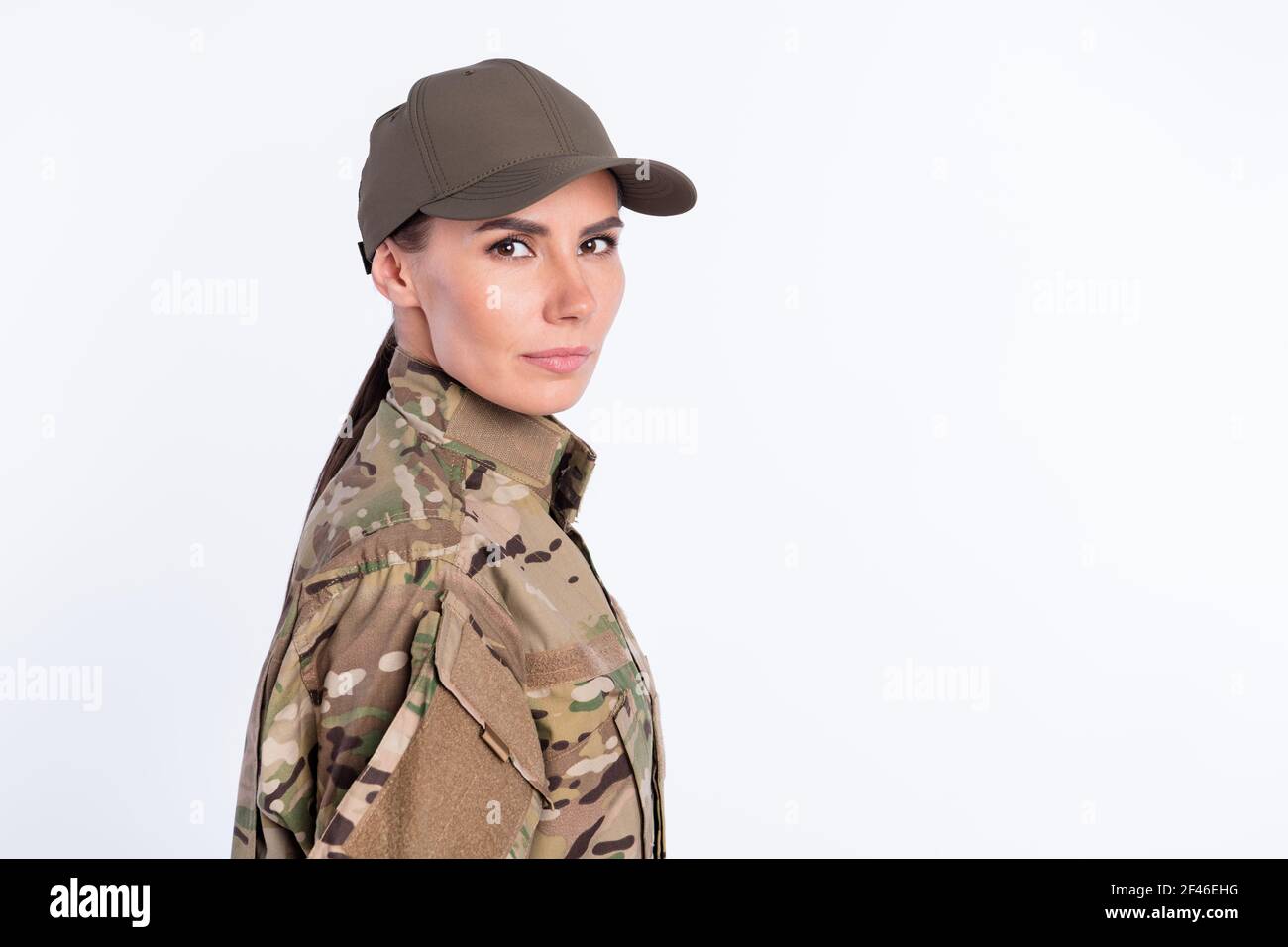 Profile portrait of charming young military girl look camera no ...