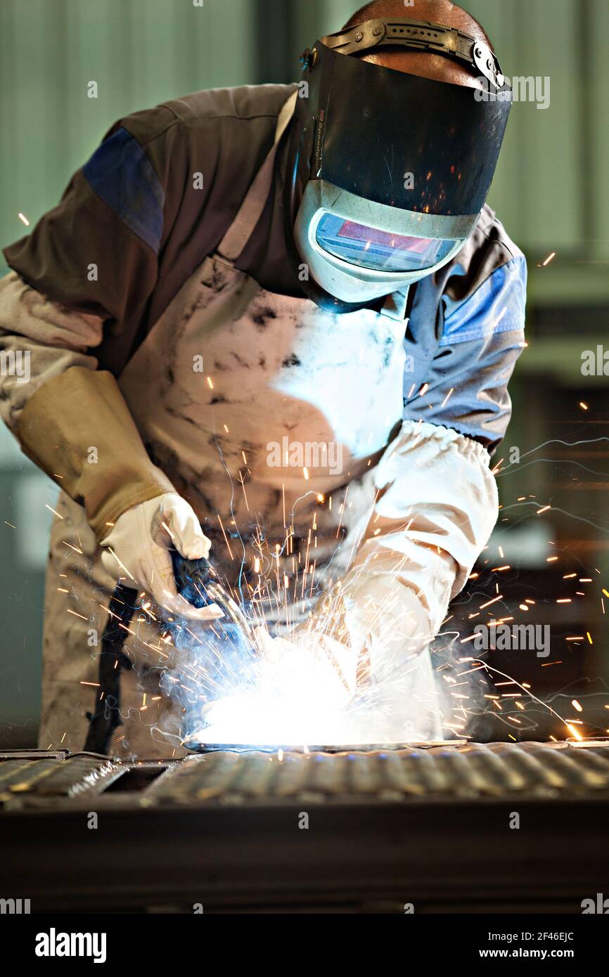manual welding of metal pieces Stock Photo - Alamy