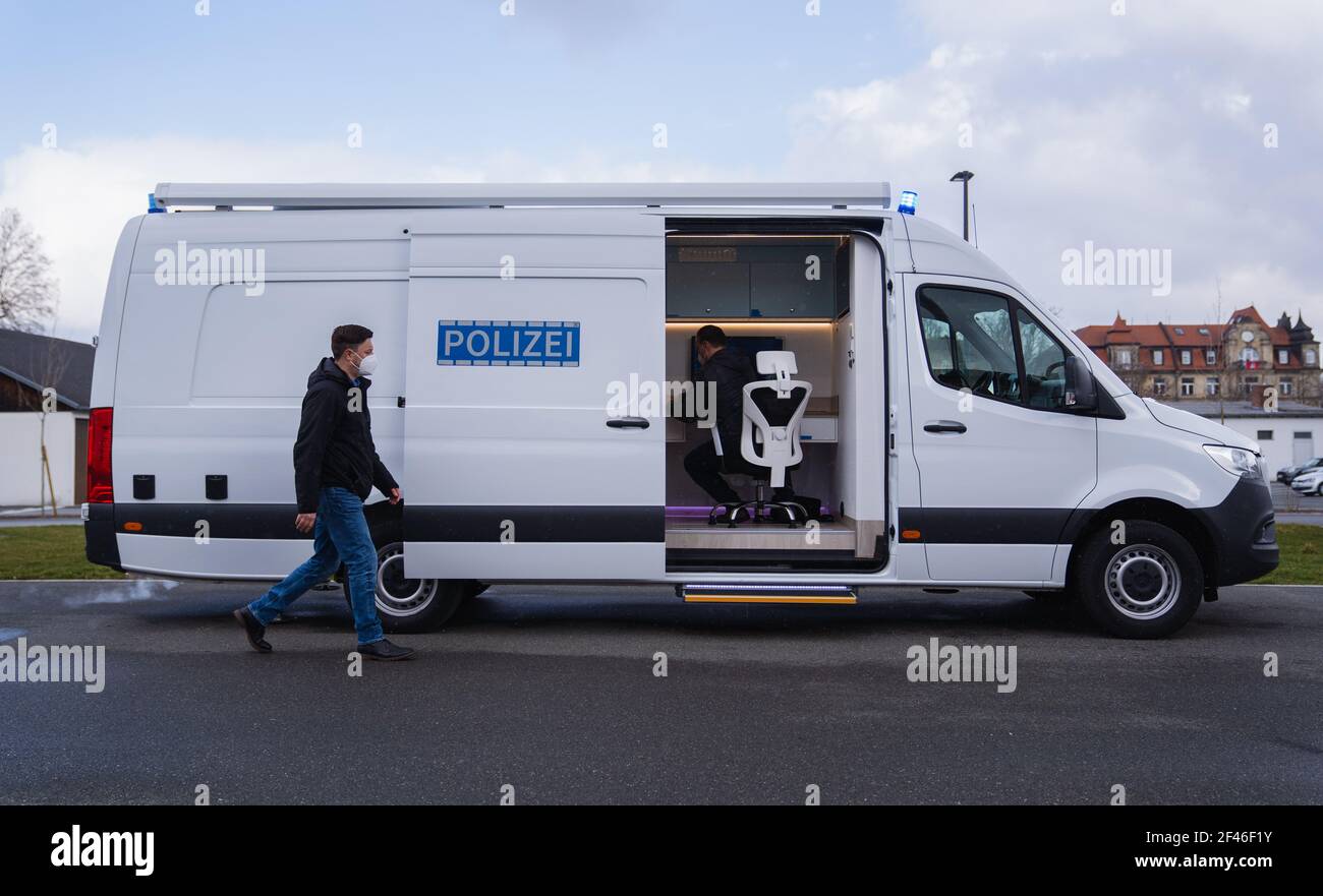 Bayreuth, Germany. 19th Mar, 2021. IT forensic experts Robin Berbalk (l ...