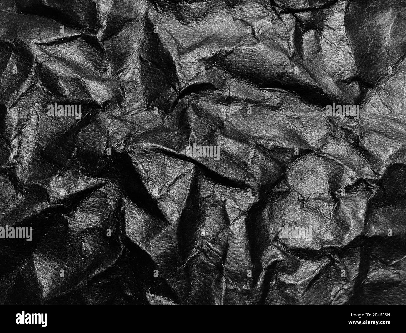 Black crumpled paper texture background. Copy space for design and ...