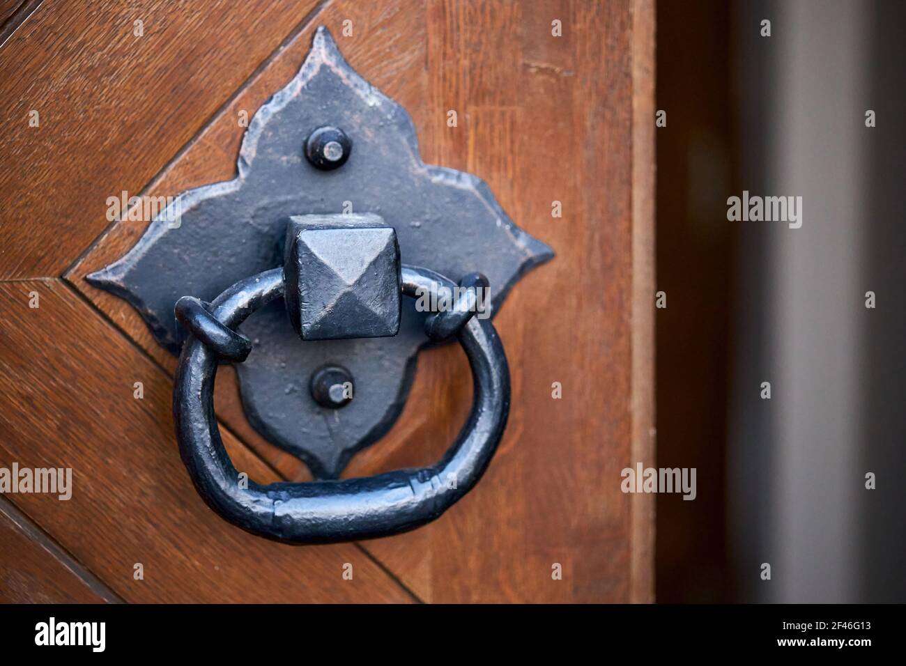 Door handle knocker selective focus on brown old wooden church entrance ...