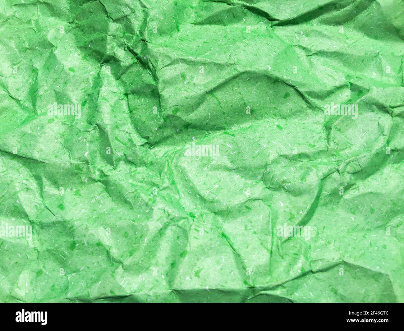 Pattern of green crumpled paper texture background Stock Photo - Alamy