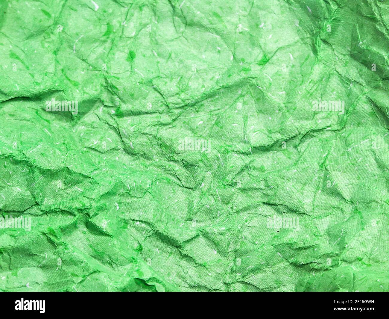 Pattern of green crumpled paper texture background Stock Photo - Alamy