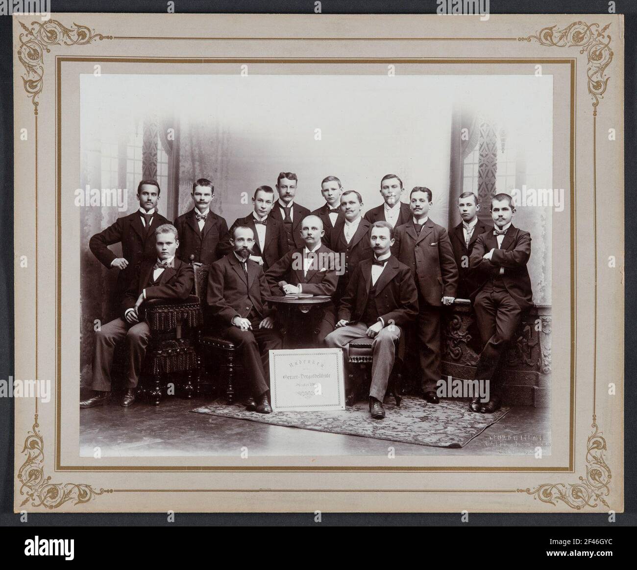 Apprentice group of 1900 in front of room decoration graduation ...