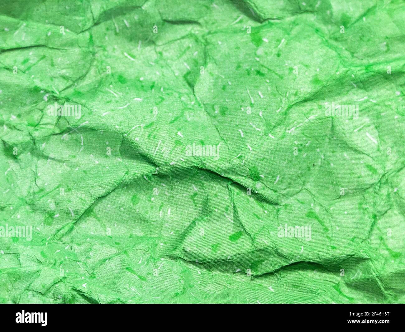 Pattern of green crumpled paper texture background Stock Photo - Alamy