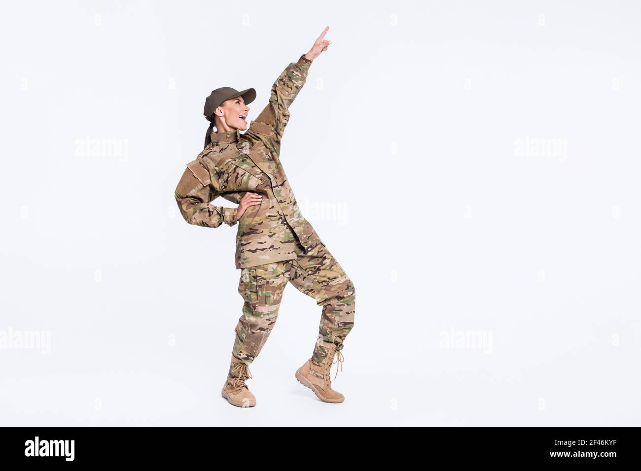 Full length photo of excited cheerful person look pointing finger empty ...