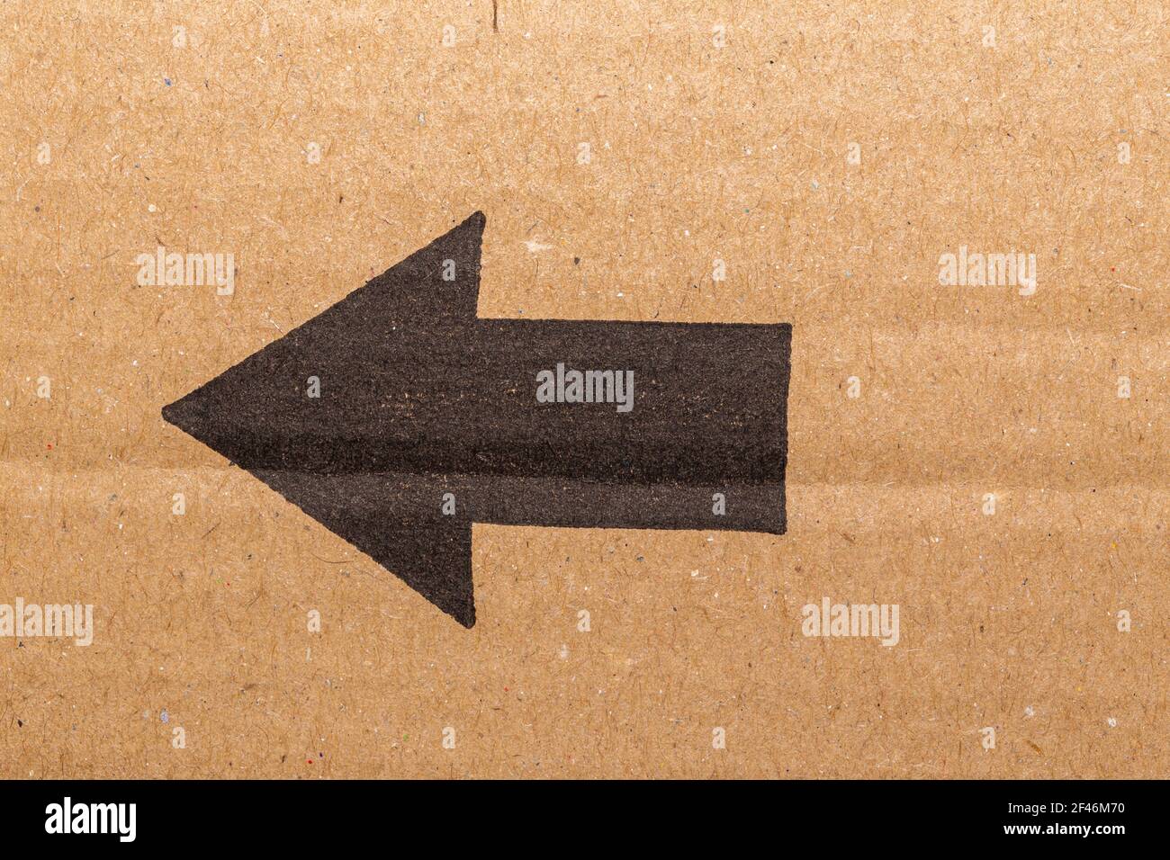 Plain Brown Cardboard with Arrow Background Stock Photo - Alamy