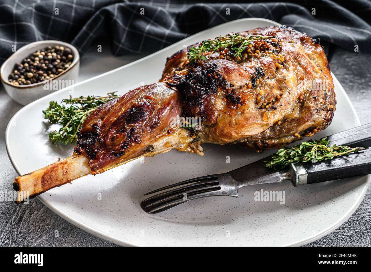 Baked goat leg with herbs. Farm meat. Gray background. Top view Stock ...