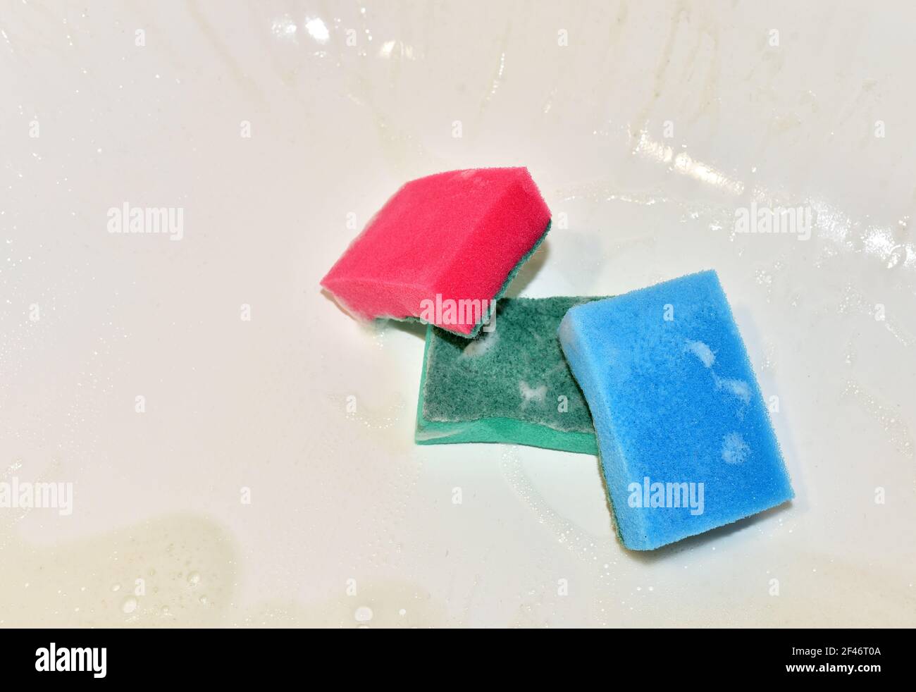 Sponge with detergent and foam while washing. Cleaning Kitchen ...