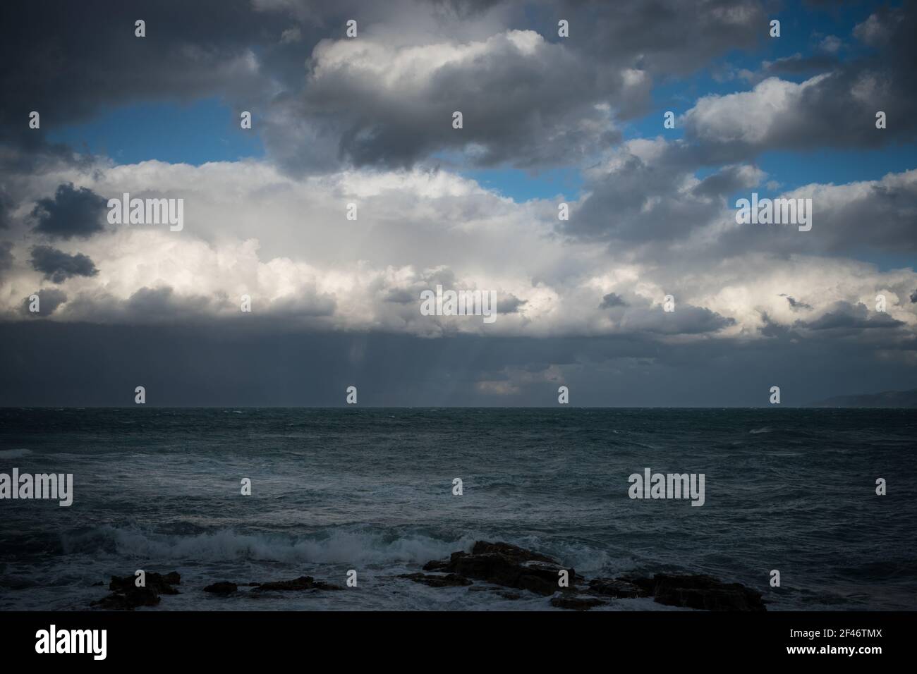 Blue sea with waves and sky with clouds before storm Stock Photo - Alamy
